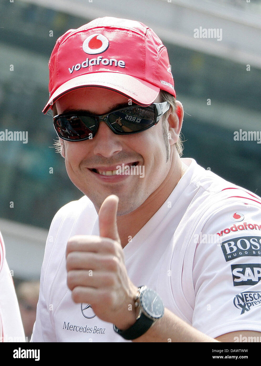 Spanish Formula One driver Fernando Alonso of McLaren Mercedes cheers ...