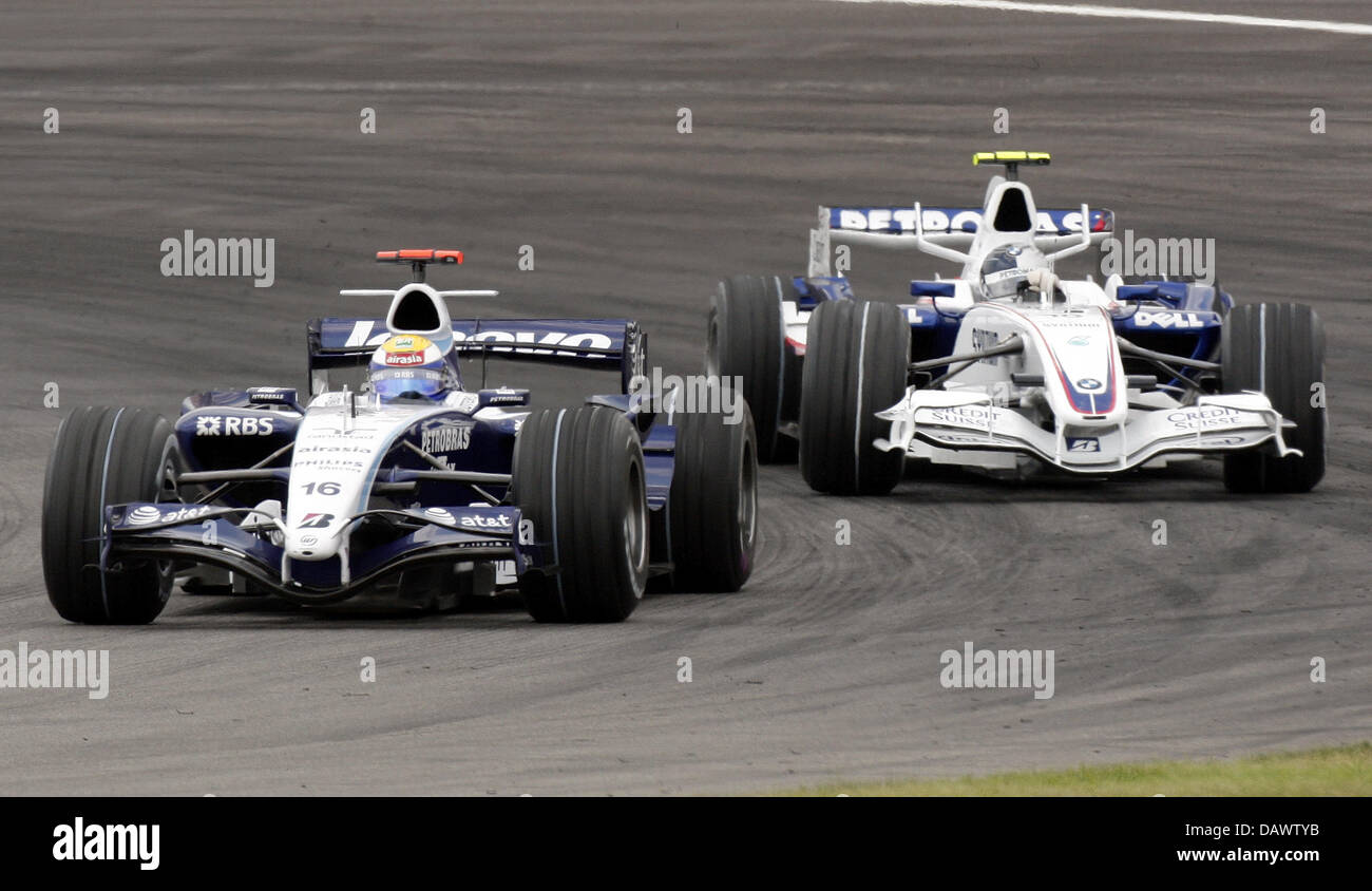 German Sebastian Vettel (R) BMW Sauber tries to pass German Formula One ...
