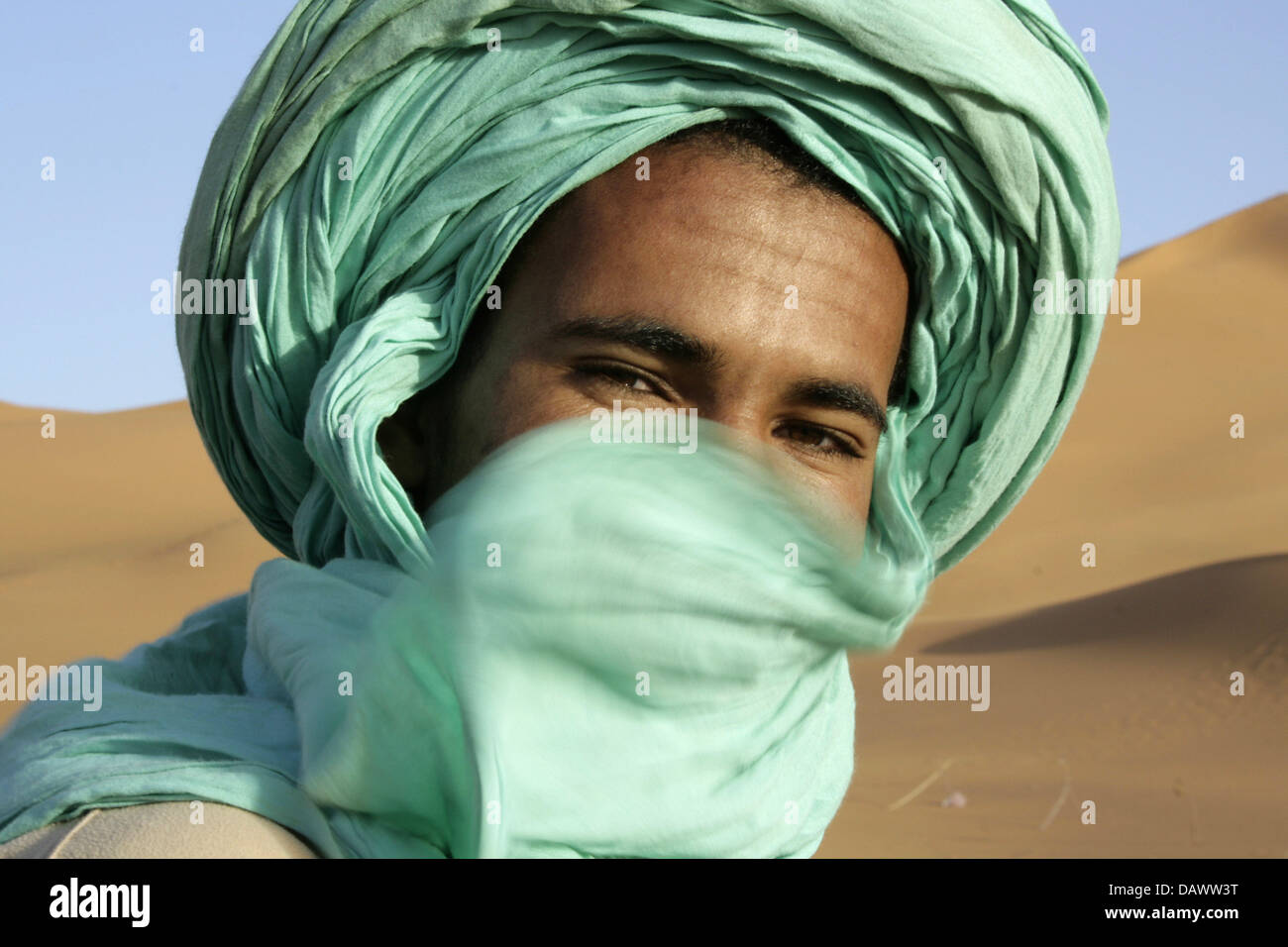 A male Berber wearing the traditional Litham head scarf depicted at an ...
