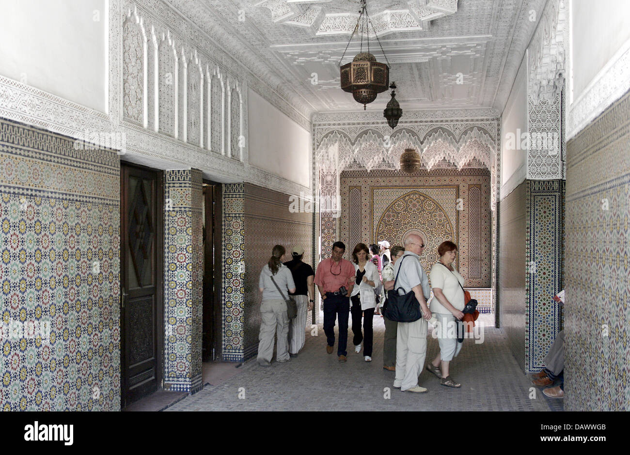 tourists take a look at the gorgeously adorned house entrance in the ...