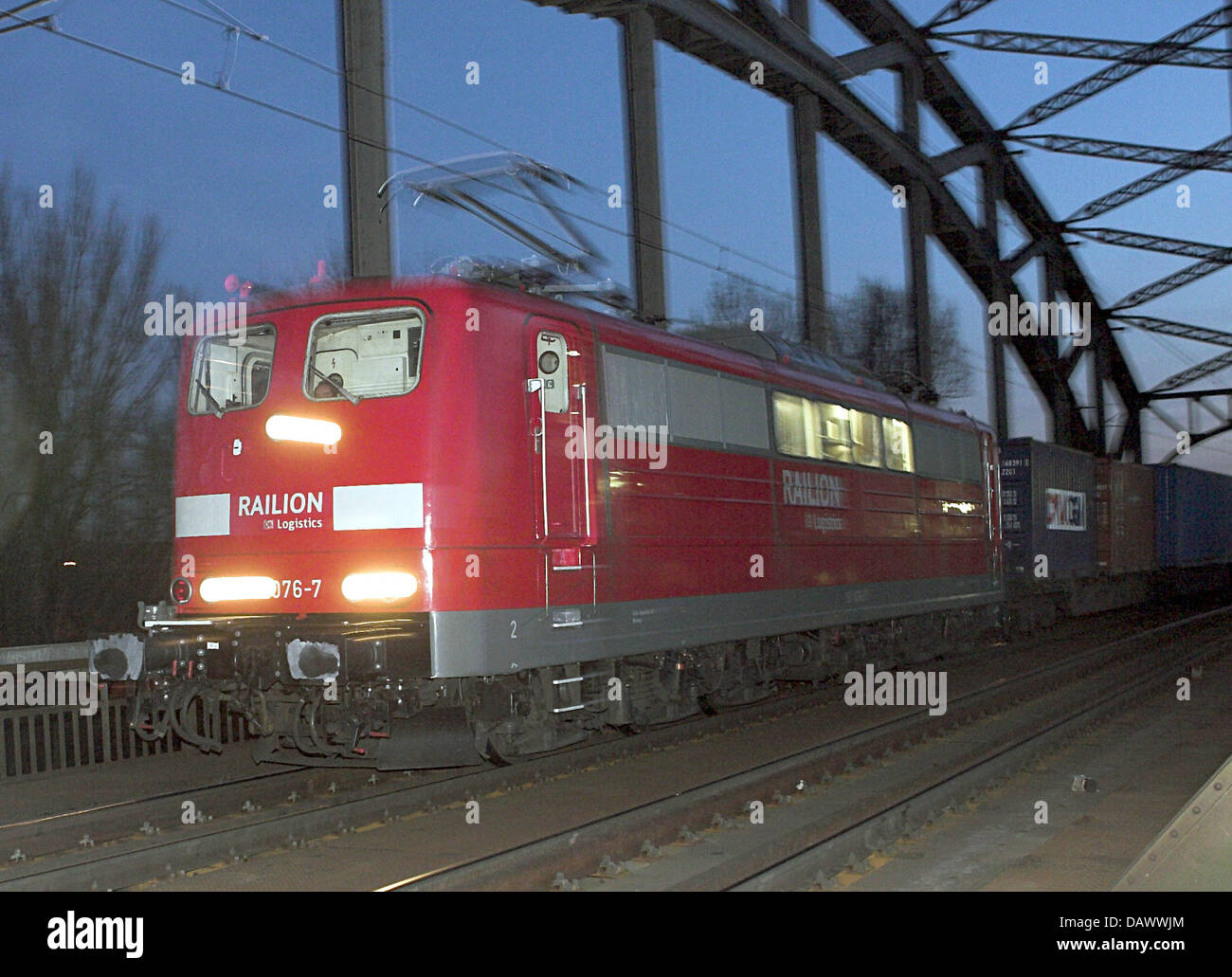 A cargo train locomotive of Railion crosses a bridge in Frankfurt Main ...