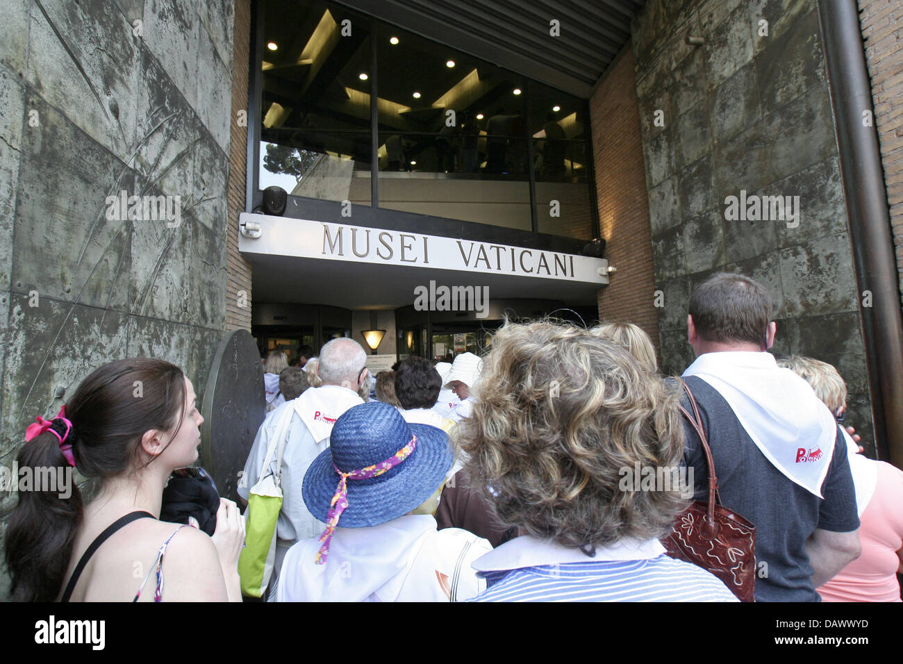 People queue in front of the entrance to the Vatican museums in Rome ...