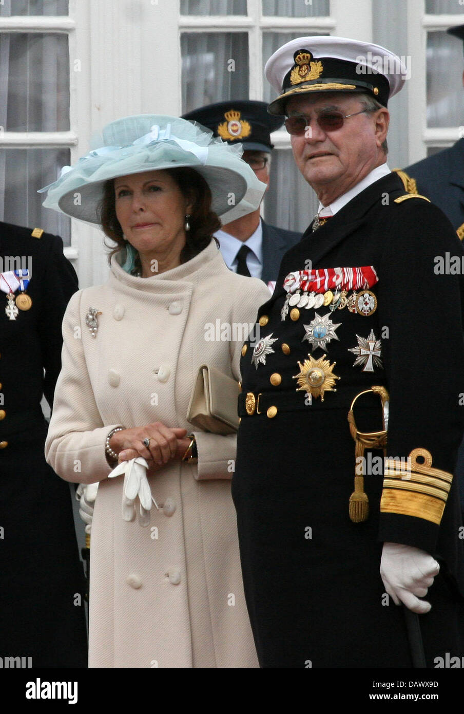 Queen Sylvia and Prince Consort Henrik are pictured at the harbour in ...