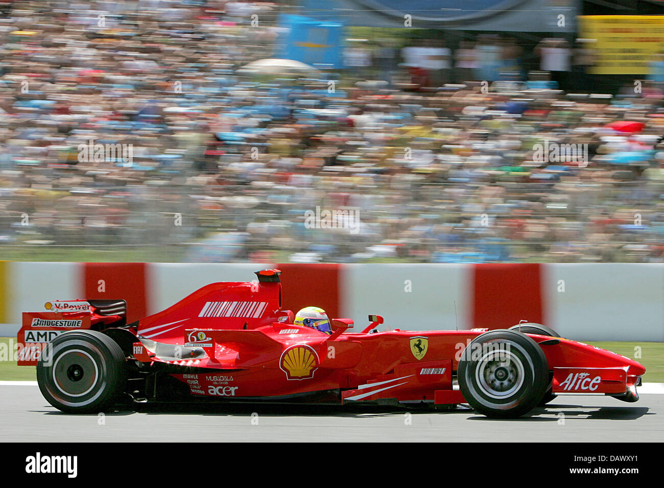 Brazilian Formula One pilot Felipe Massa of Ferrari (R) steers his car ...