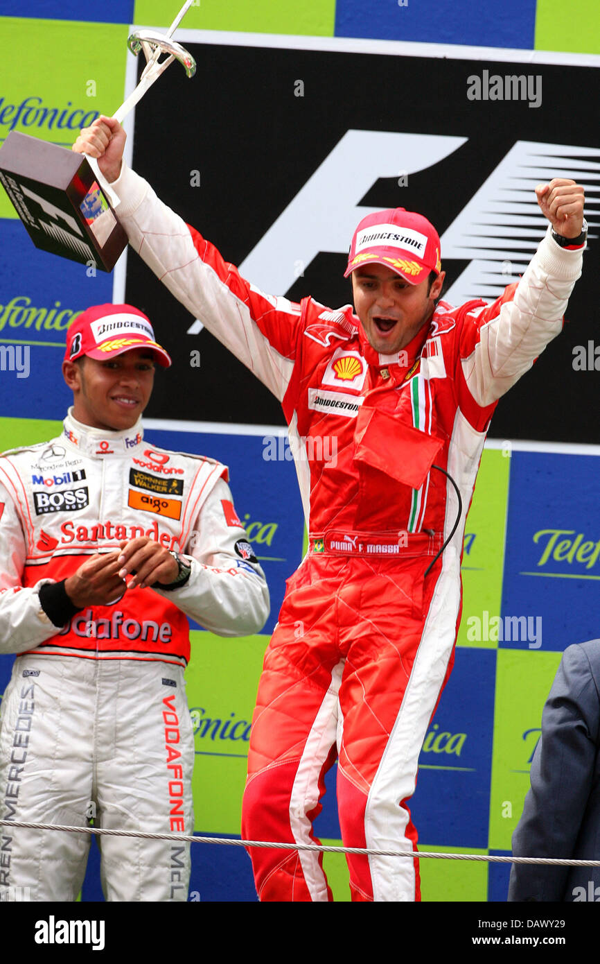 Brazilian Formula One pilot Felipe Massa of Ferrari (R)celebrates his ...