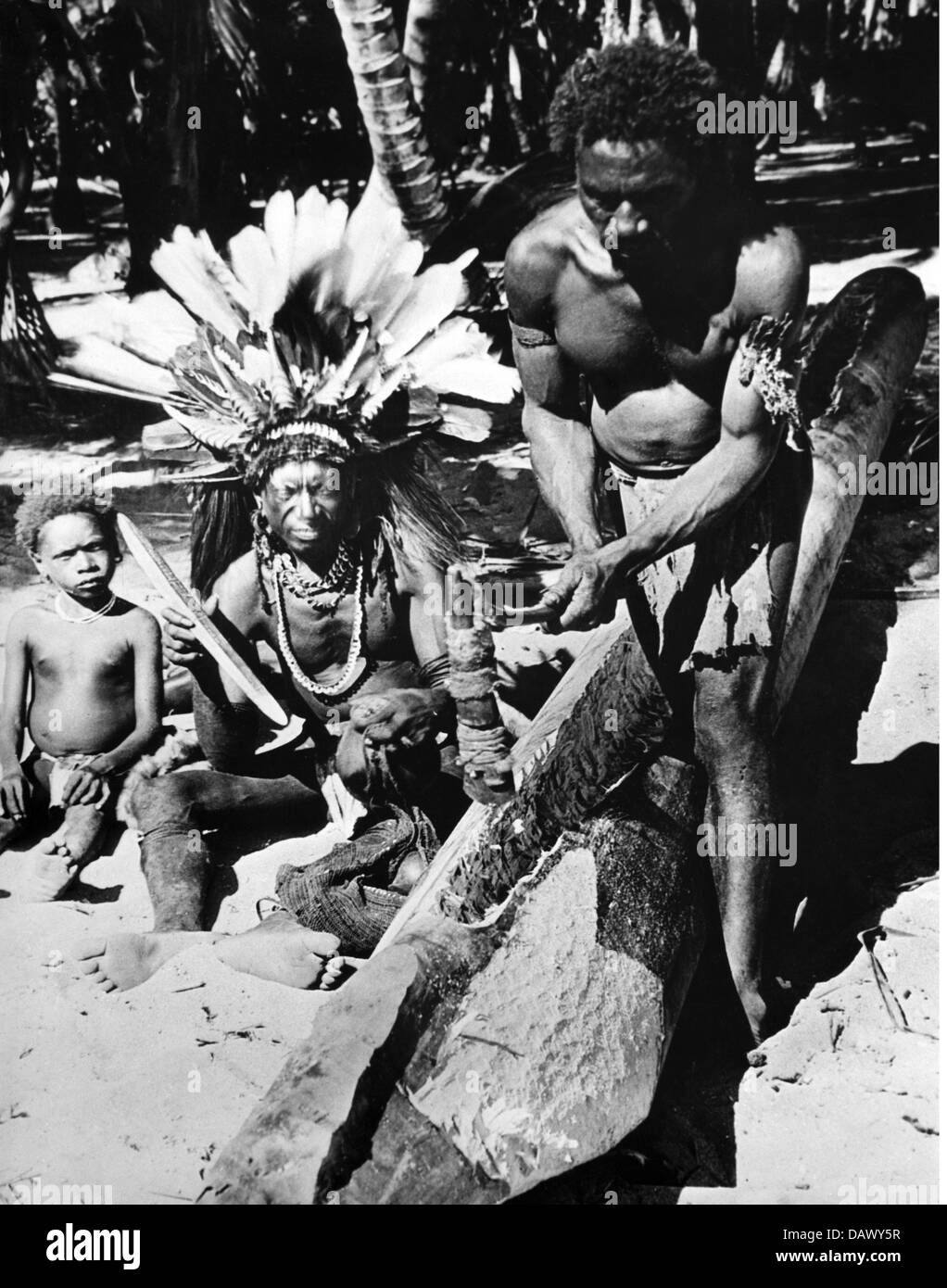 geography / travel, Papua New Guinea, people, natives making a canoe by ...