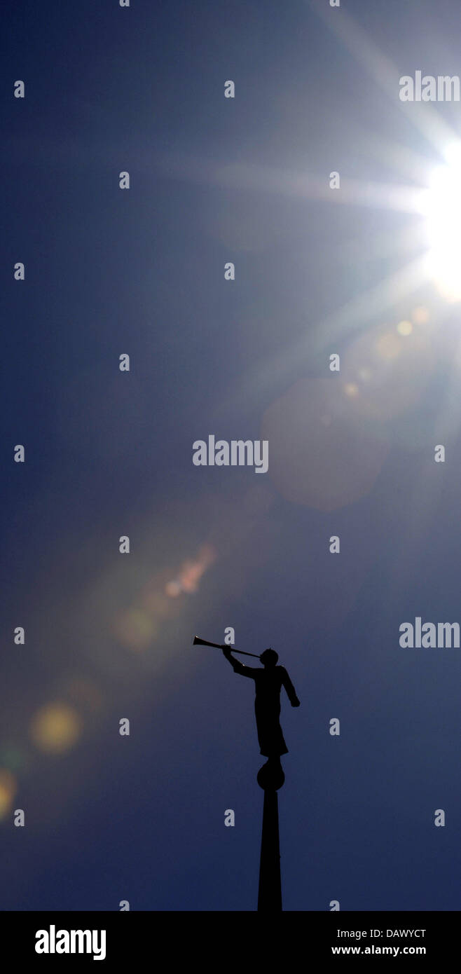 The figure of Angel Moroni is pictured on top of the tower of the ...