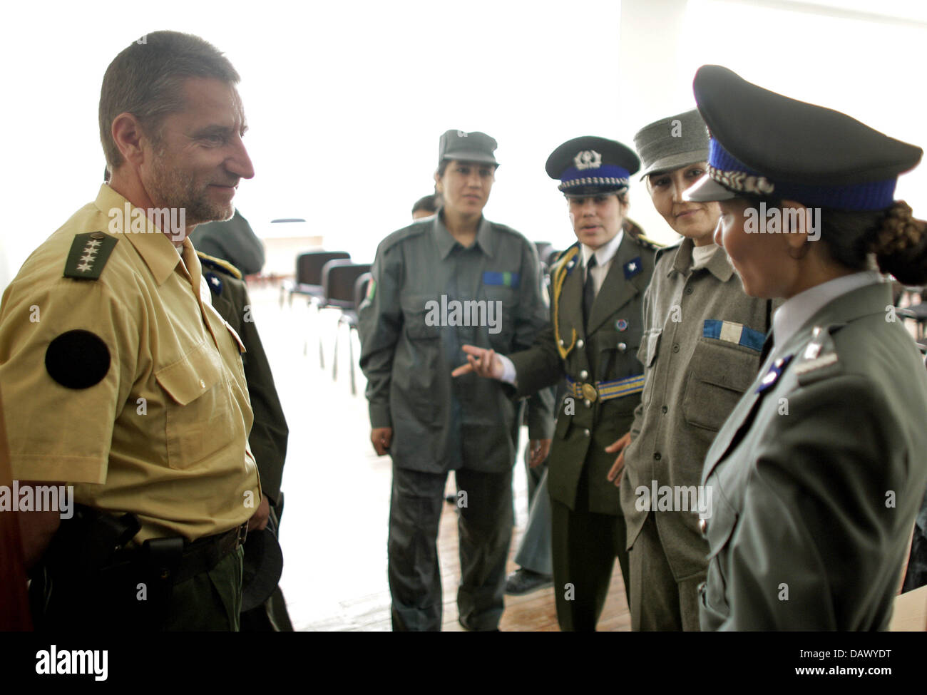 A German police man talks to a group of female students at the police ...