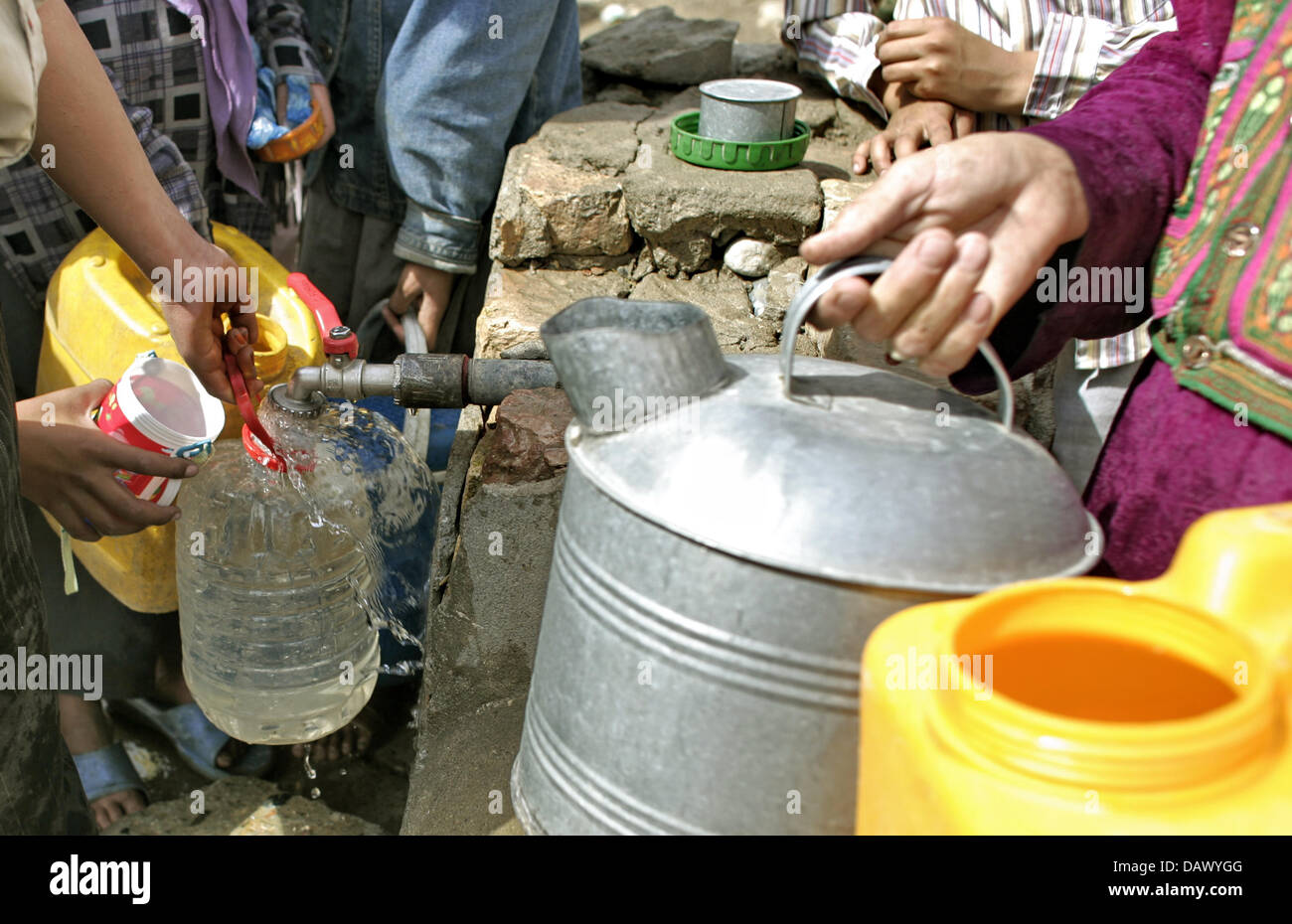 Different vessels for transporting water pictured at a public water ...