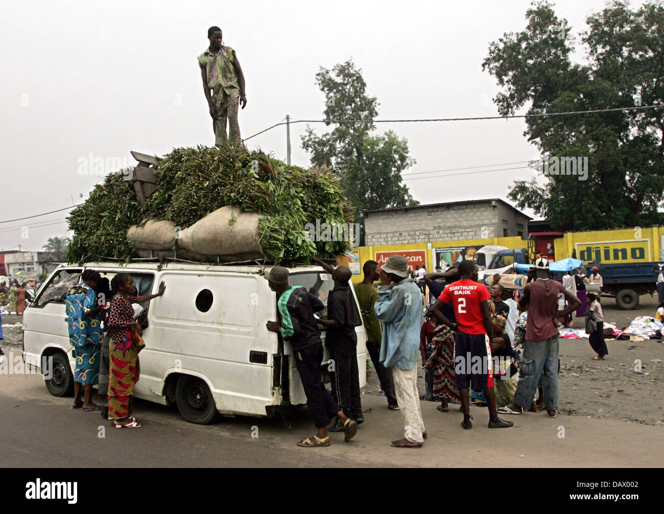 The picture shows a fully loaded minibus in Kinshasa, Democratic ...