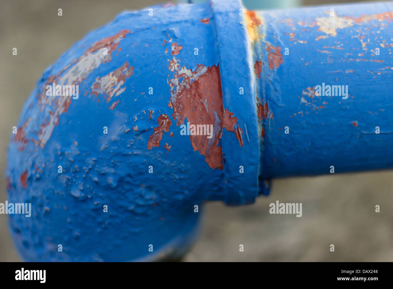 peeling paint on the side of a pipe Stock Photo - Alamy