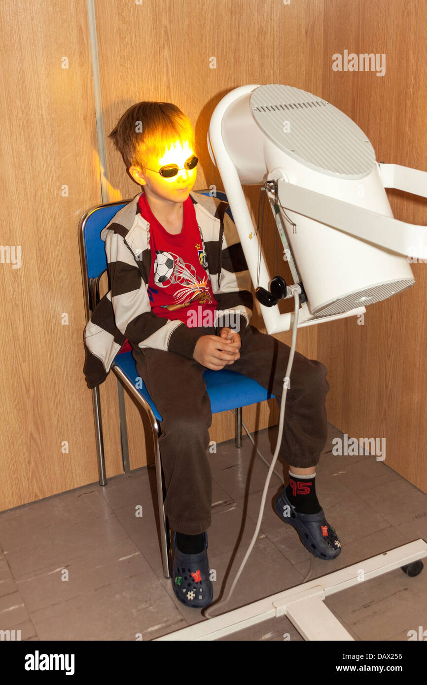 Boy undergoing light therapy Stock Photo - Alamy