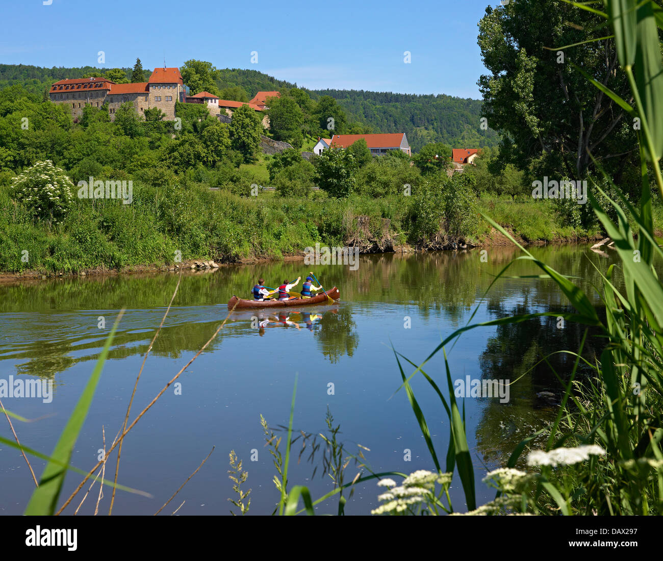 Castle and paddlers on Werra River, Creuzburg, Thuringia, Germany Stock ...