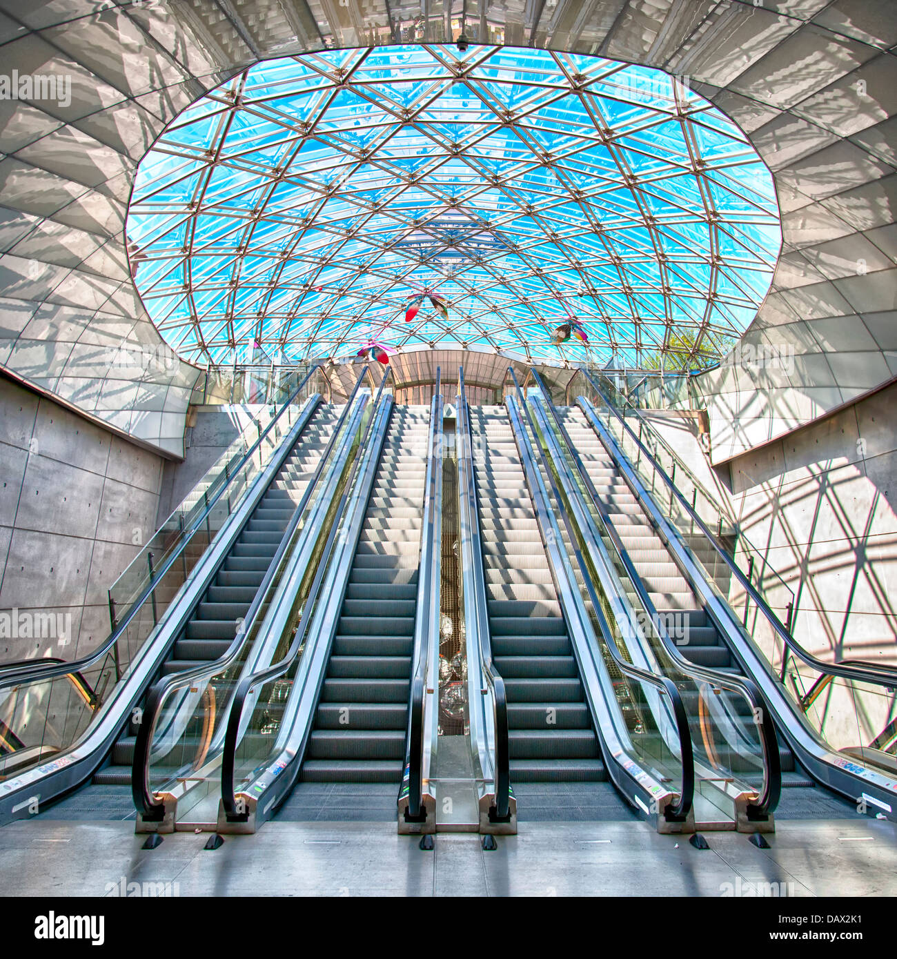 Tube station escalators in the big city Stock Photo - Alamy
