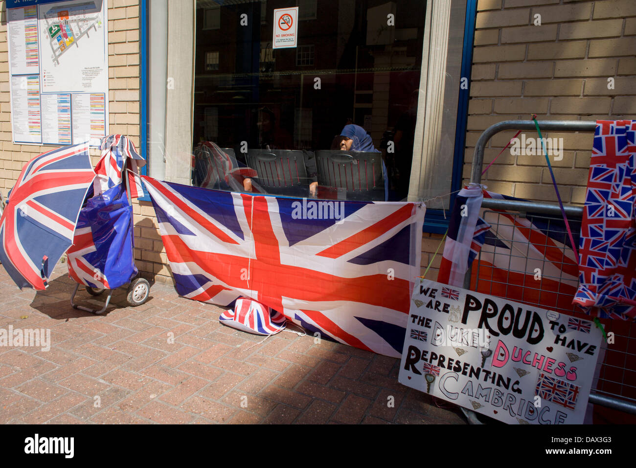 London 19th July 2013: Muslim woman looks out of window as tension ...