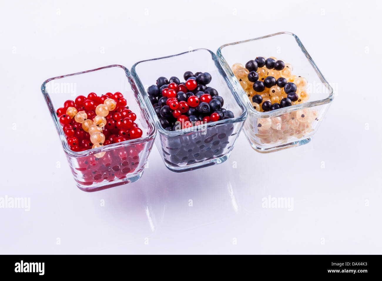 Blue berry, red and white currant on white background Stock Photo - Alamy
