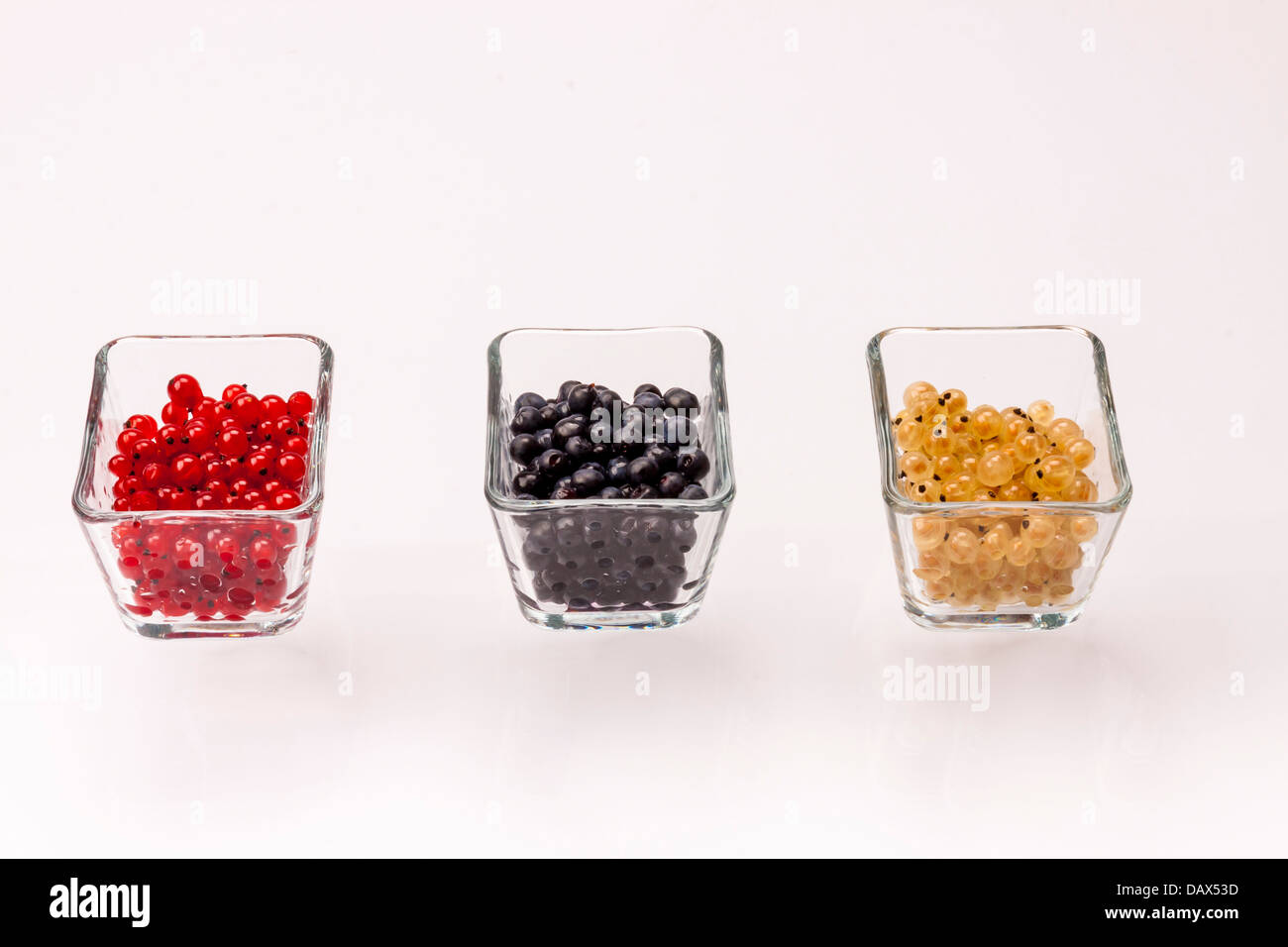 Blue berry, red and white currant on white background Stock Photo - Alamy