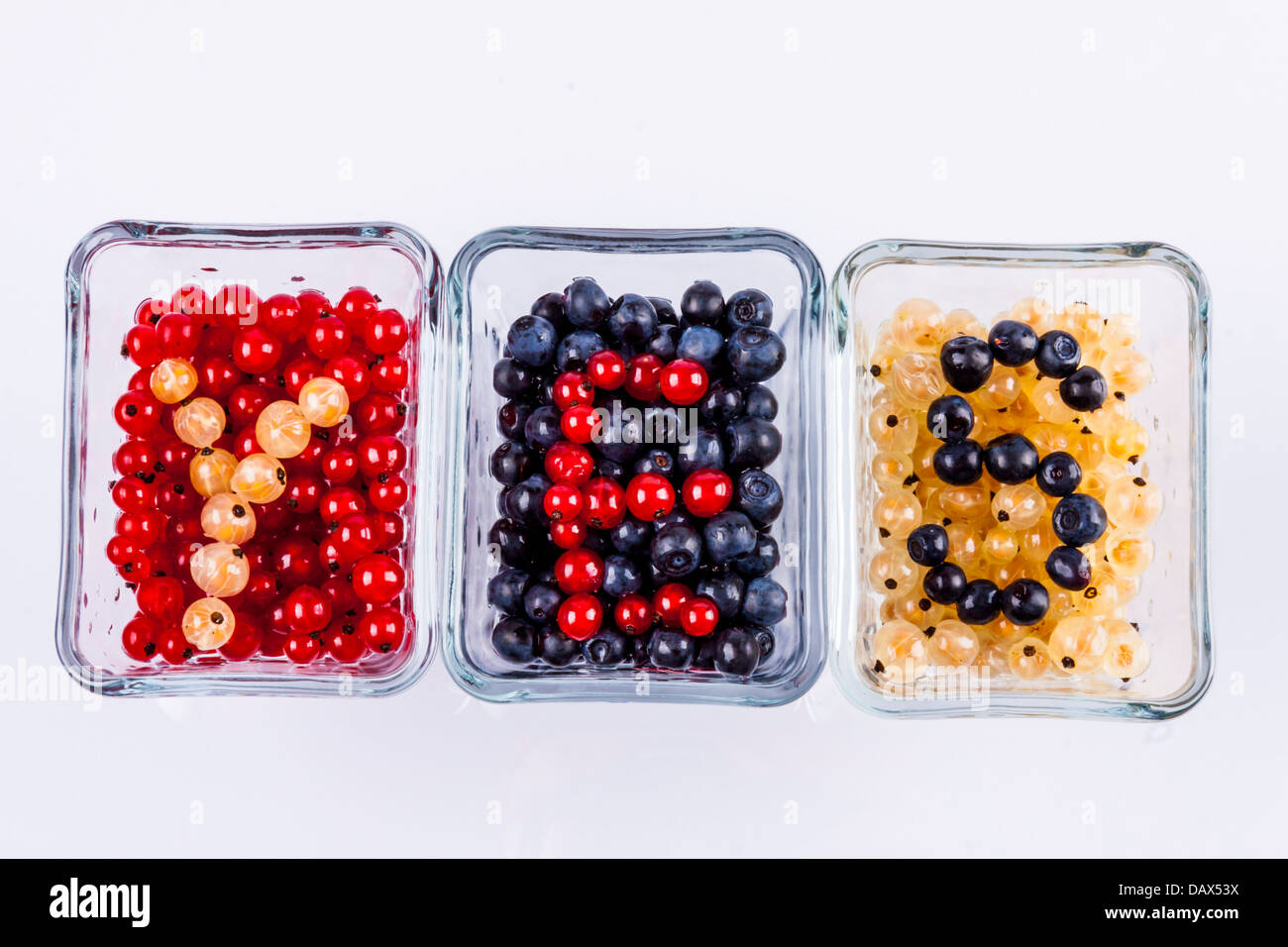 Blue berry, red and white currant on white background Stock Photo - Alamy
