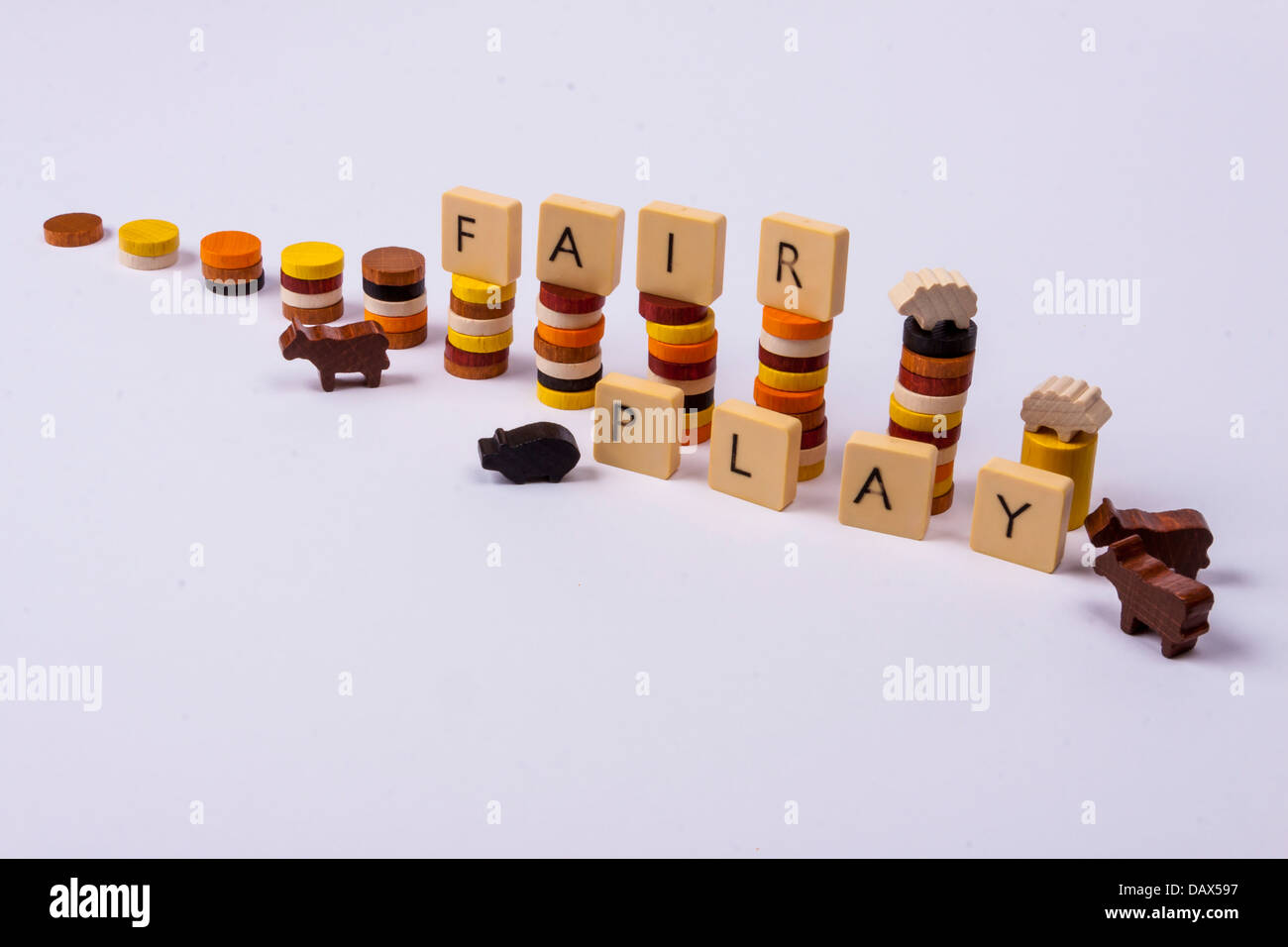 Fair play game - wooden column on white background Stock Photo - Alamy