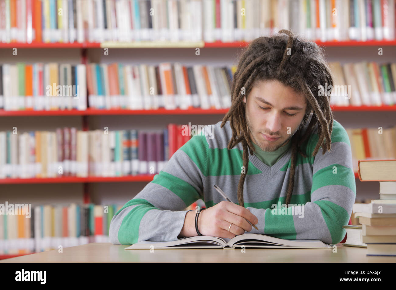 Student in library Stock Photo - Alamy