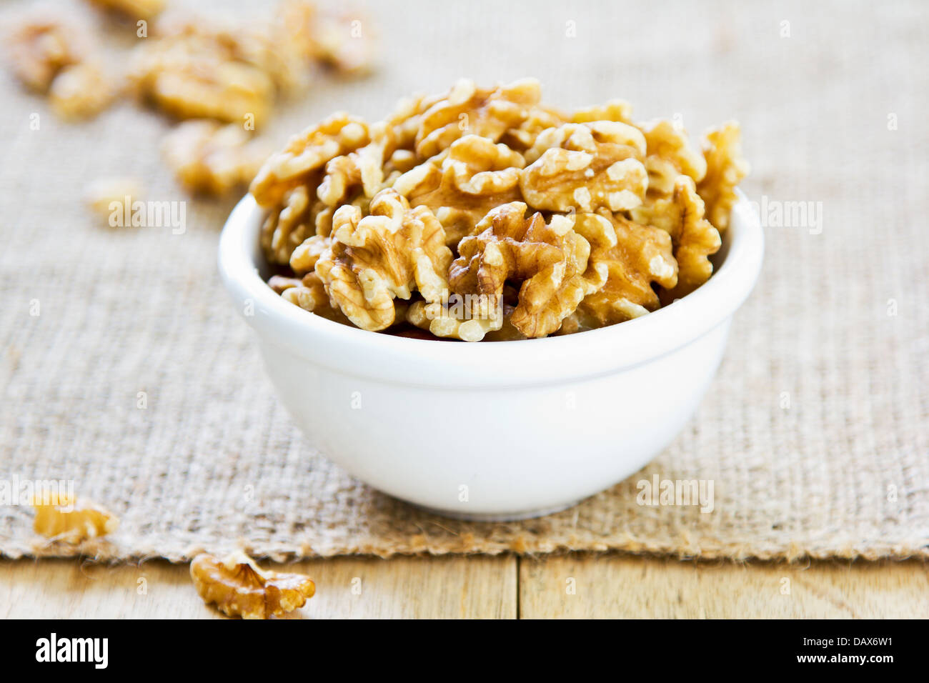 Walnut in a white bowl Stock Photo - Alamy