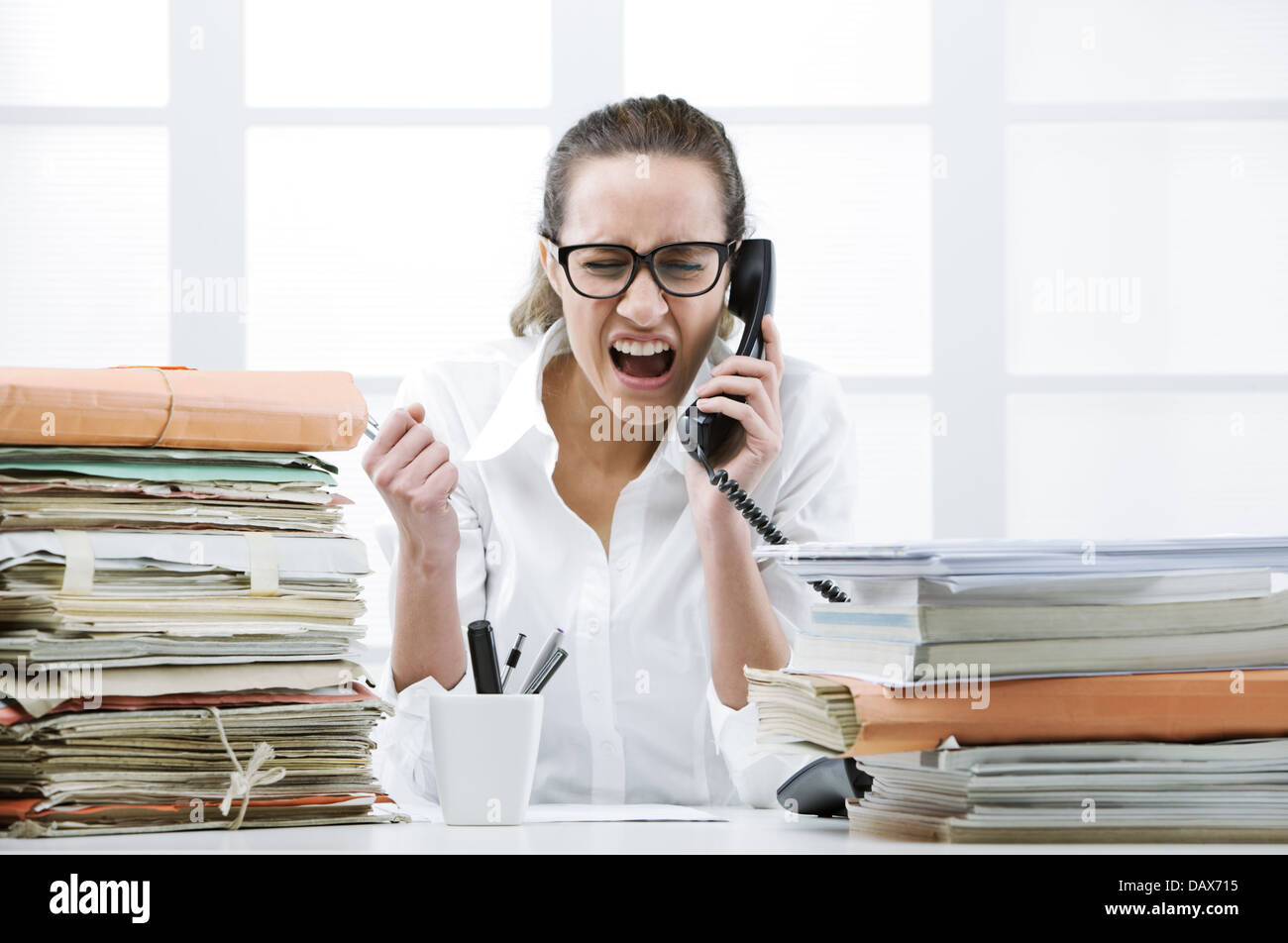 Angry Business woman Shouting At Phone Stock Photo - Alamy