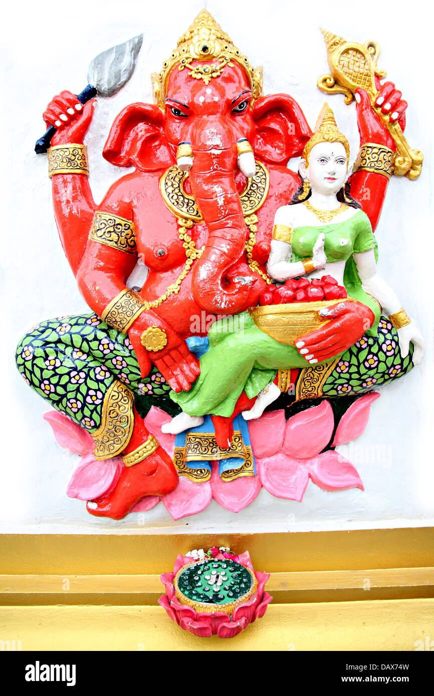 Red Statue Ganesh in temple on the wall Stock Photo - Alamy