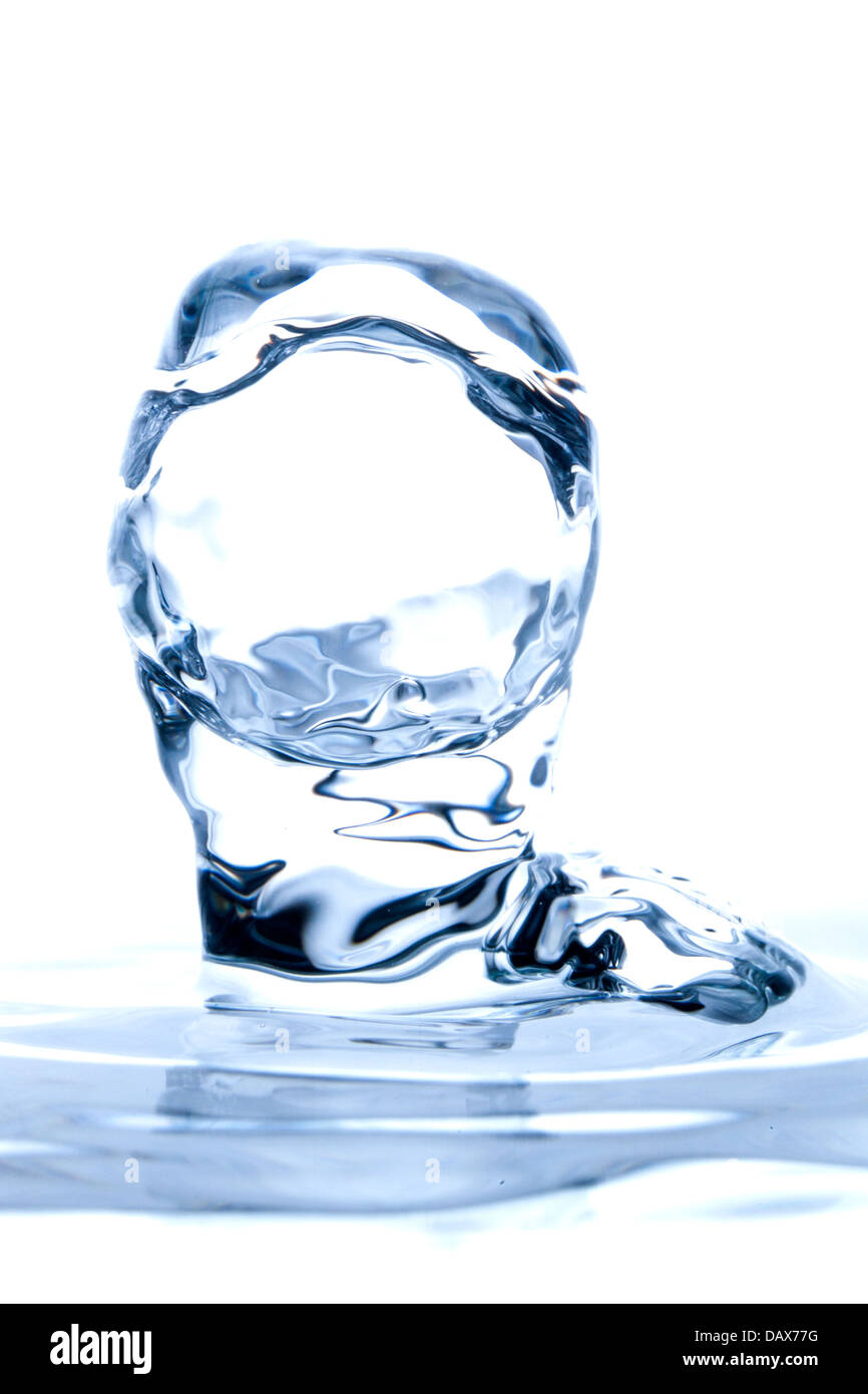 Water Drop Impact On The Liquid Surface White Background Stock Photo ...