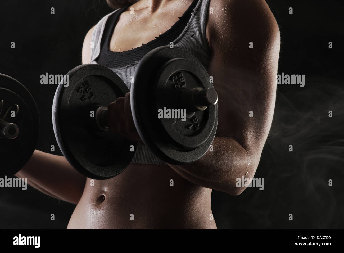 Lifting the dumbbells Stock Photo - Alamy