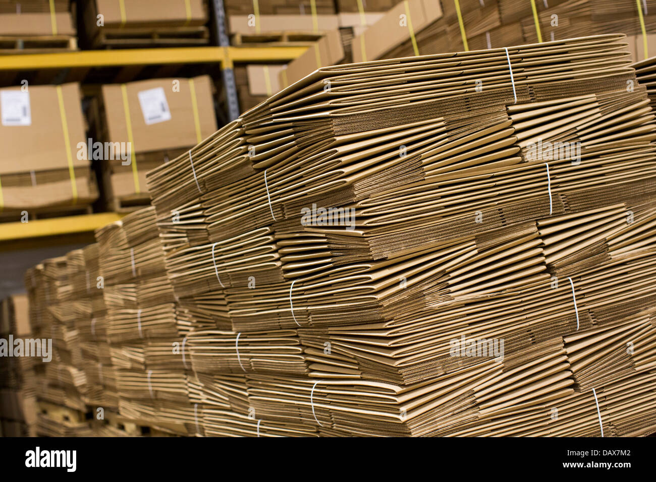 An industrial warehouse full of cardboard boxes on shelving Stock Photo ...