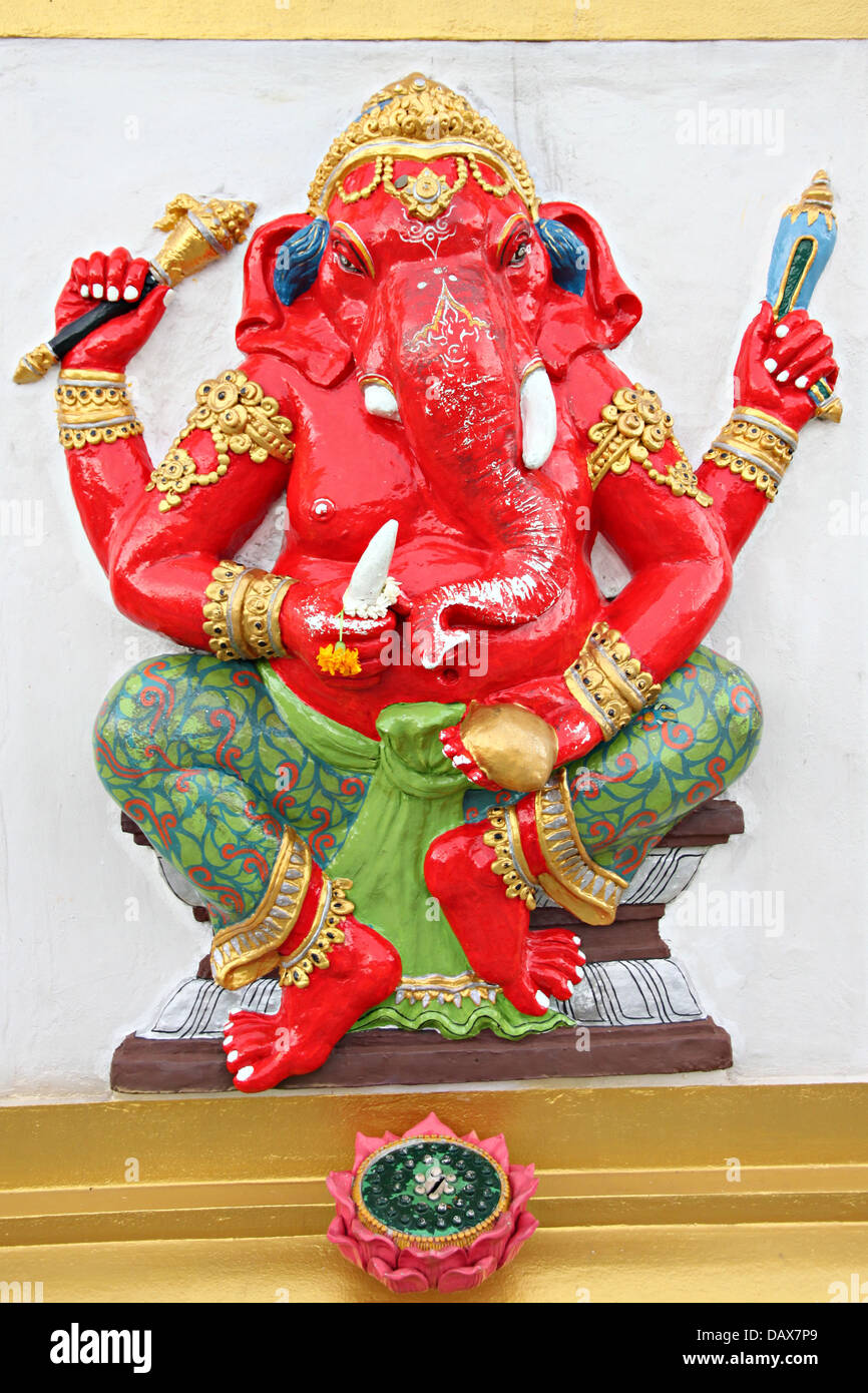 Red Statue Ganesh in temple on the wall Stock Photo - Alamy
