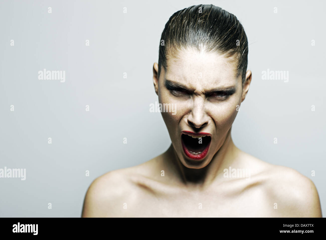 Beautiful woman shouting angry Stock Photo - Alamy