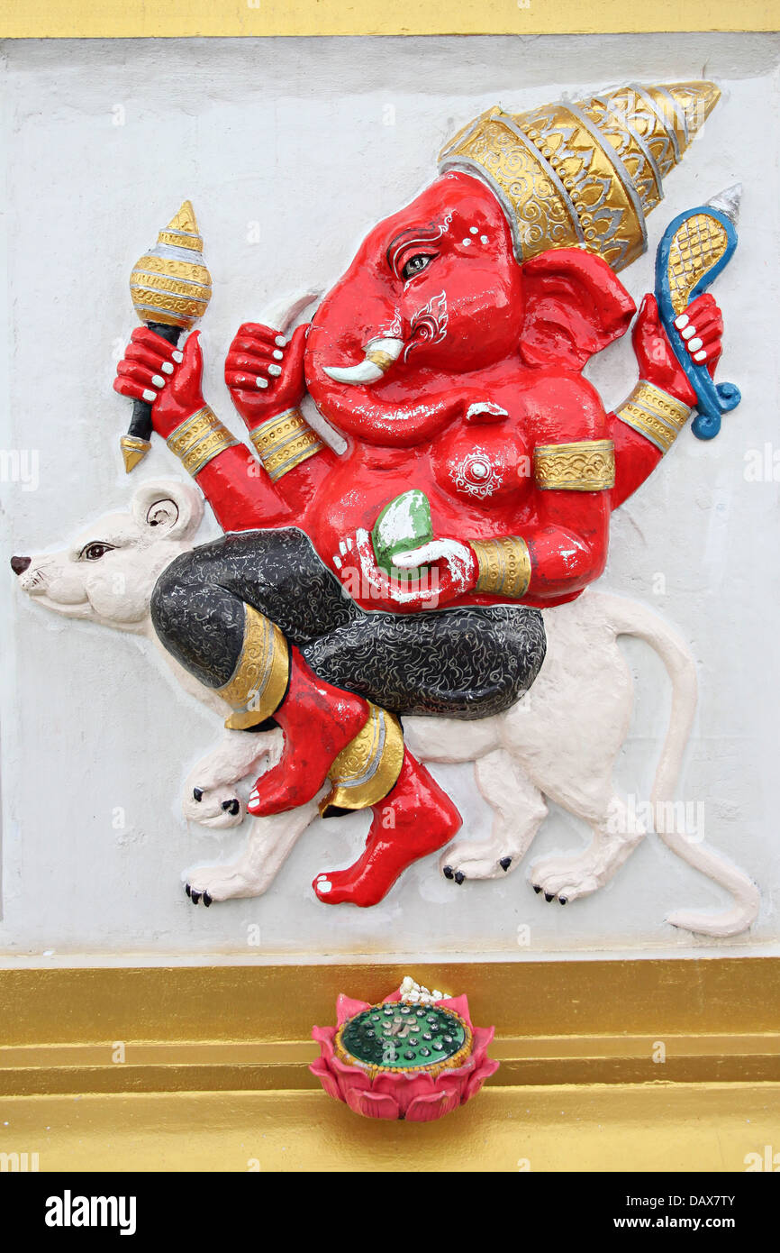 Red Statue Ganesh in temple on the wall Stock Photo - Alamy