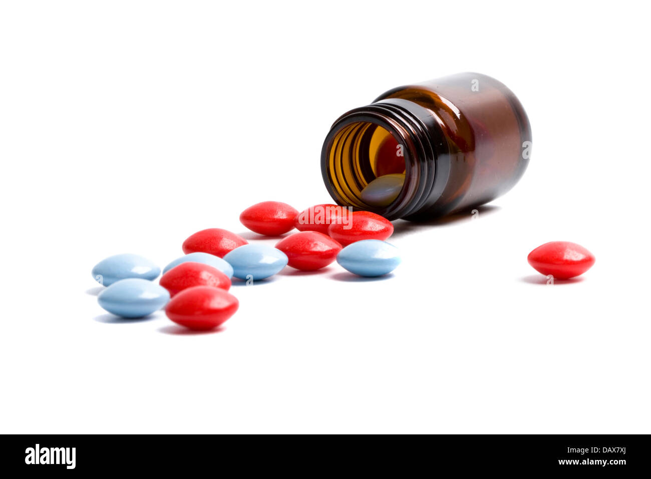 glass bottle with red and blue pills Stock Photo - Alamy