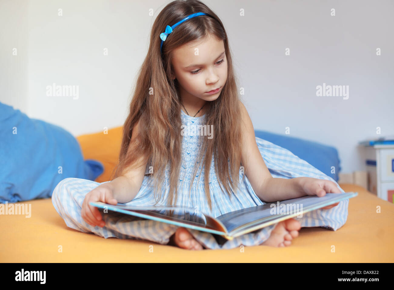 Child reading a book Stock Photo - Alamy
