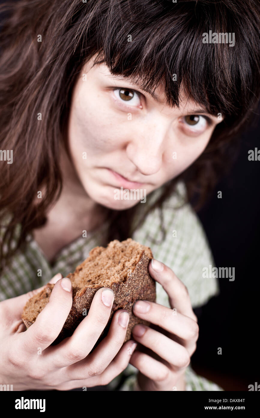 beggar woman with a piece of bread Stock Photo - Alamy