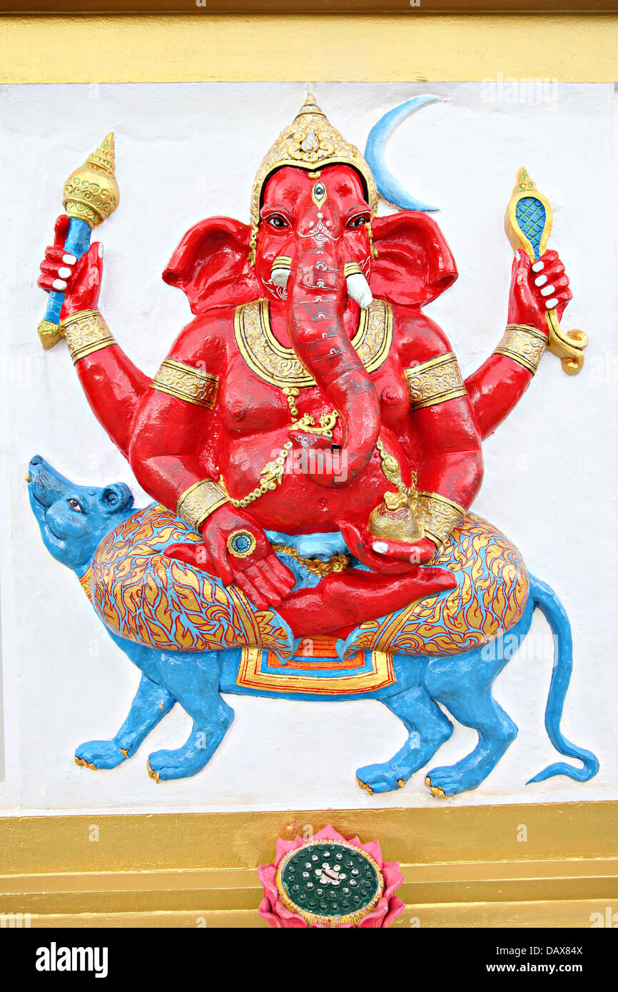 Red Statue Ganesh in the temple on the wall Stock Photo - Alamy