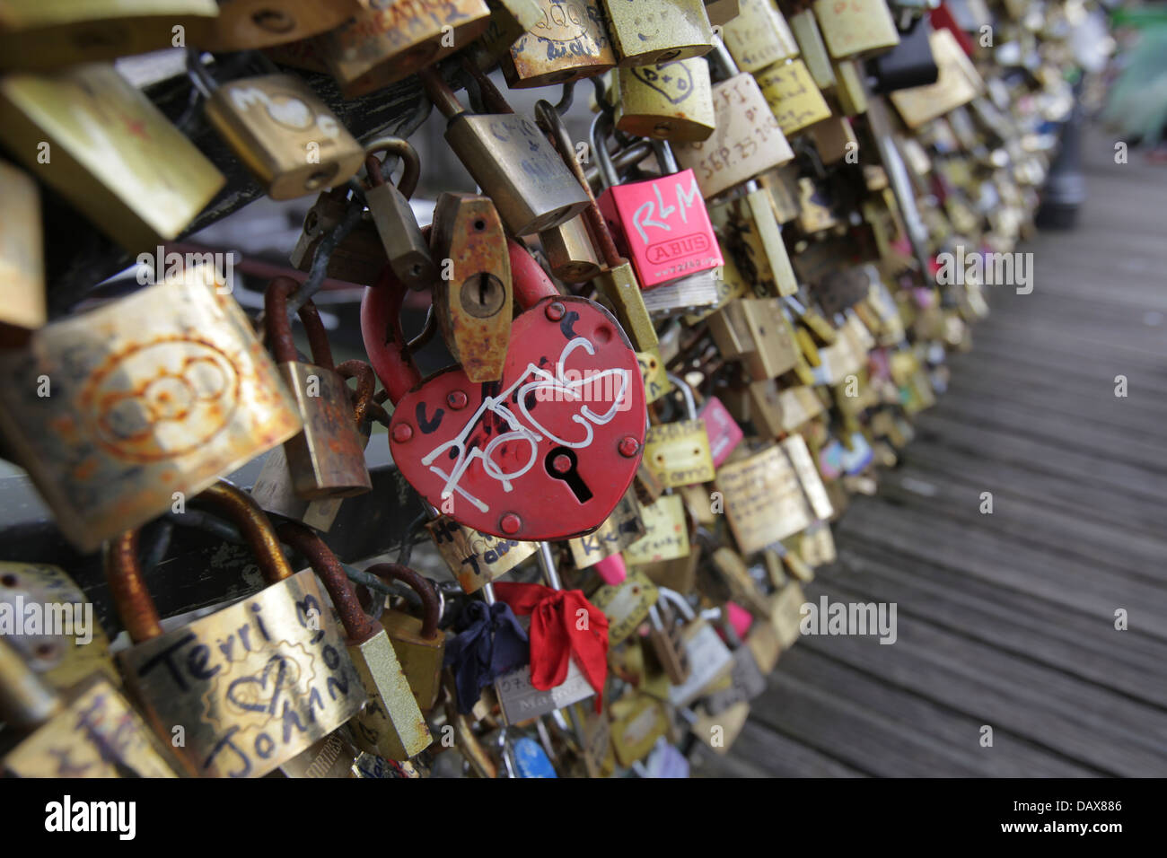 Padlocks left by couples on the 'love lock' bridge in Paris, France ...