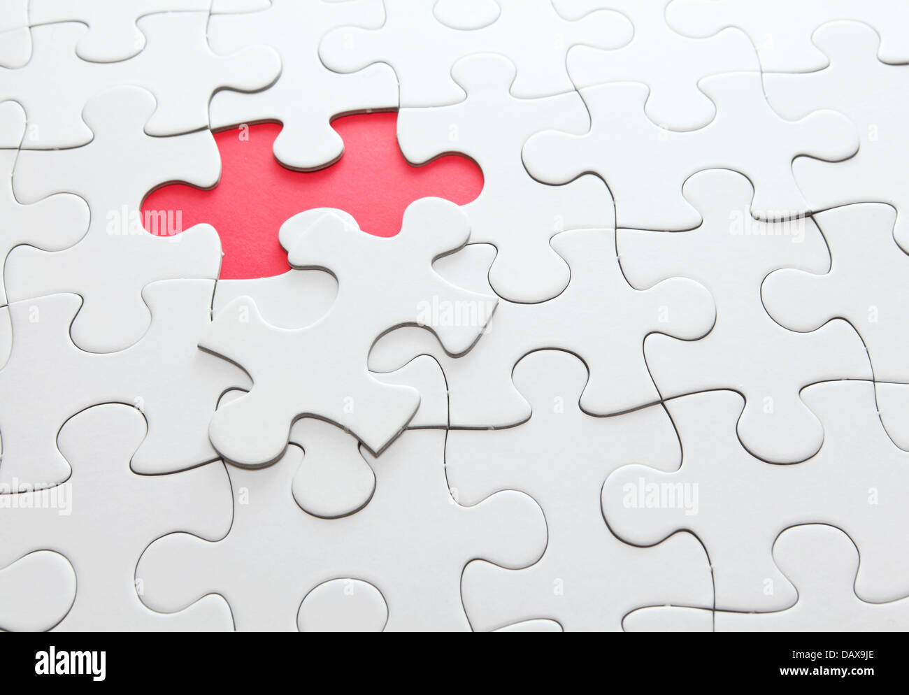 puzzle with missing red piece Stock Photo - Alamy