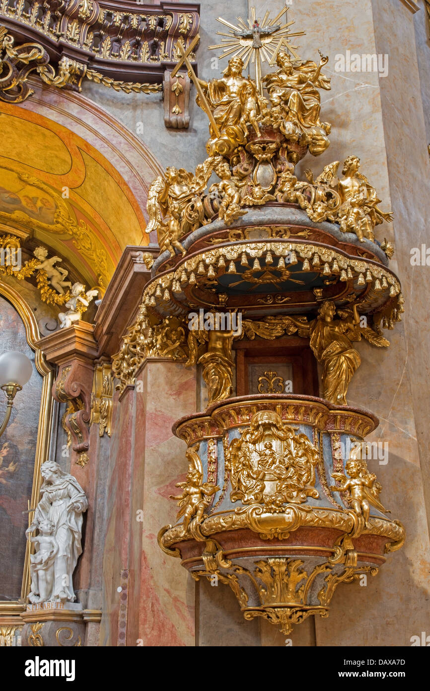 VIENNA - JULY 3: Baroque pulpit with the Holy Trinity on summit in ...