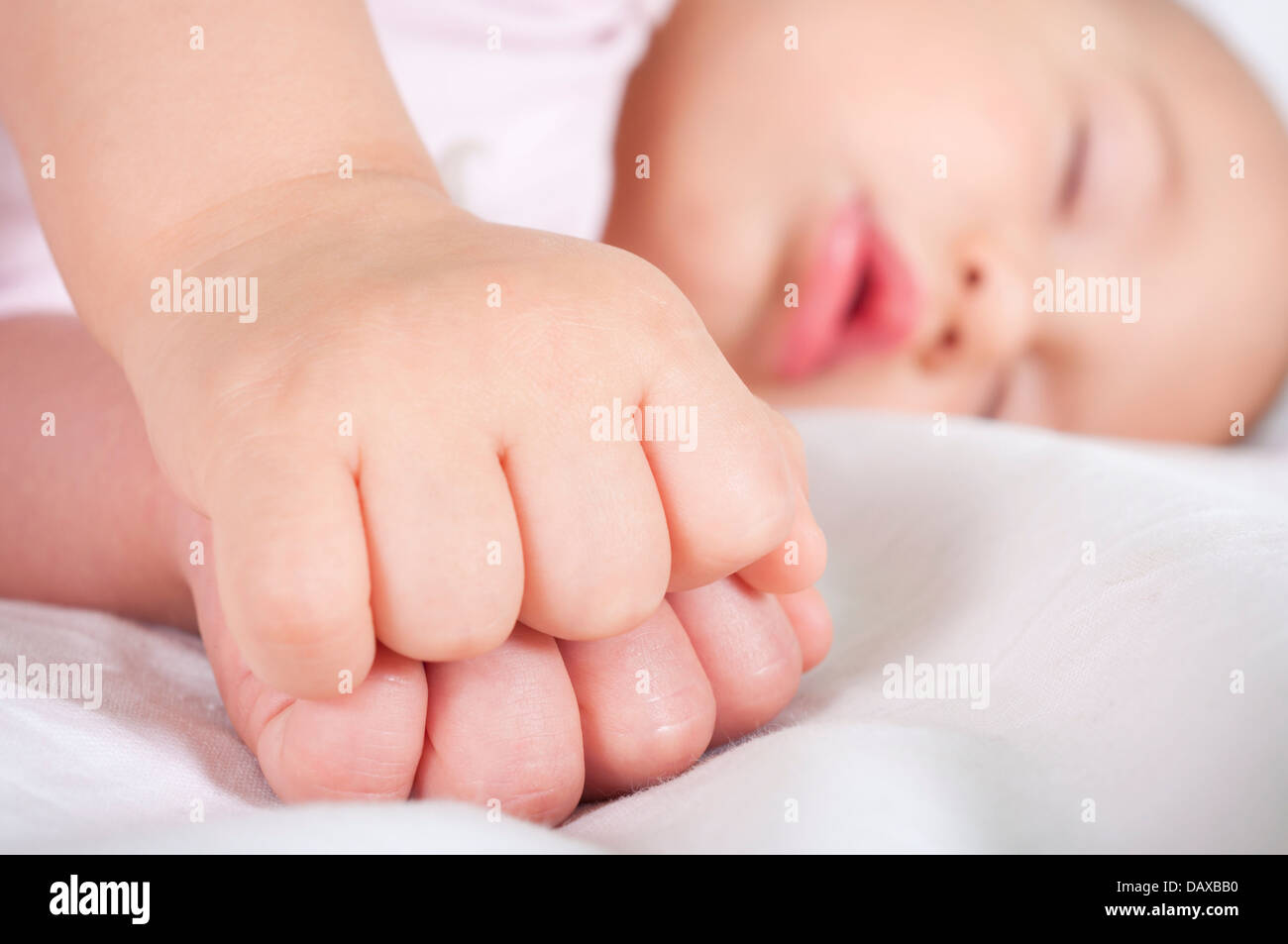 Two fists of the little baby Stock Photo - Alamy