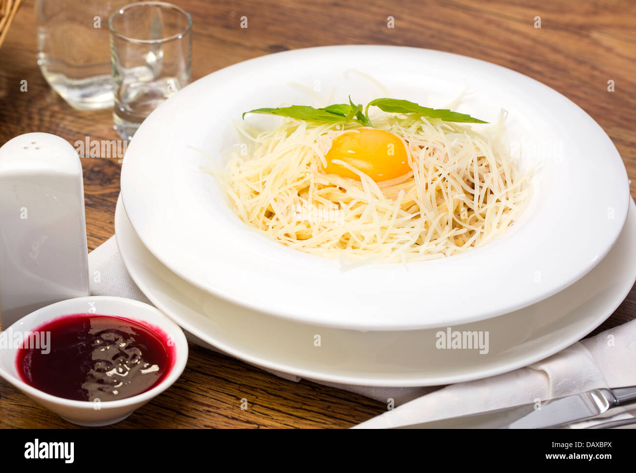 spaghetti with egg on a table in a restaurant Stock Photo - Alamy