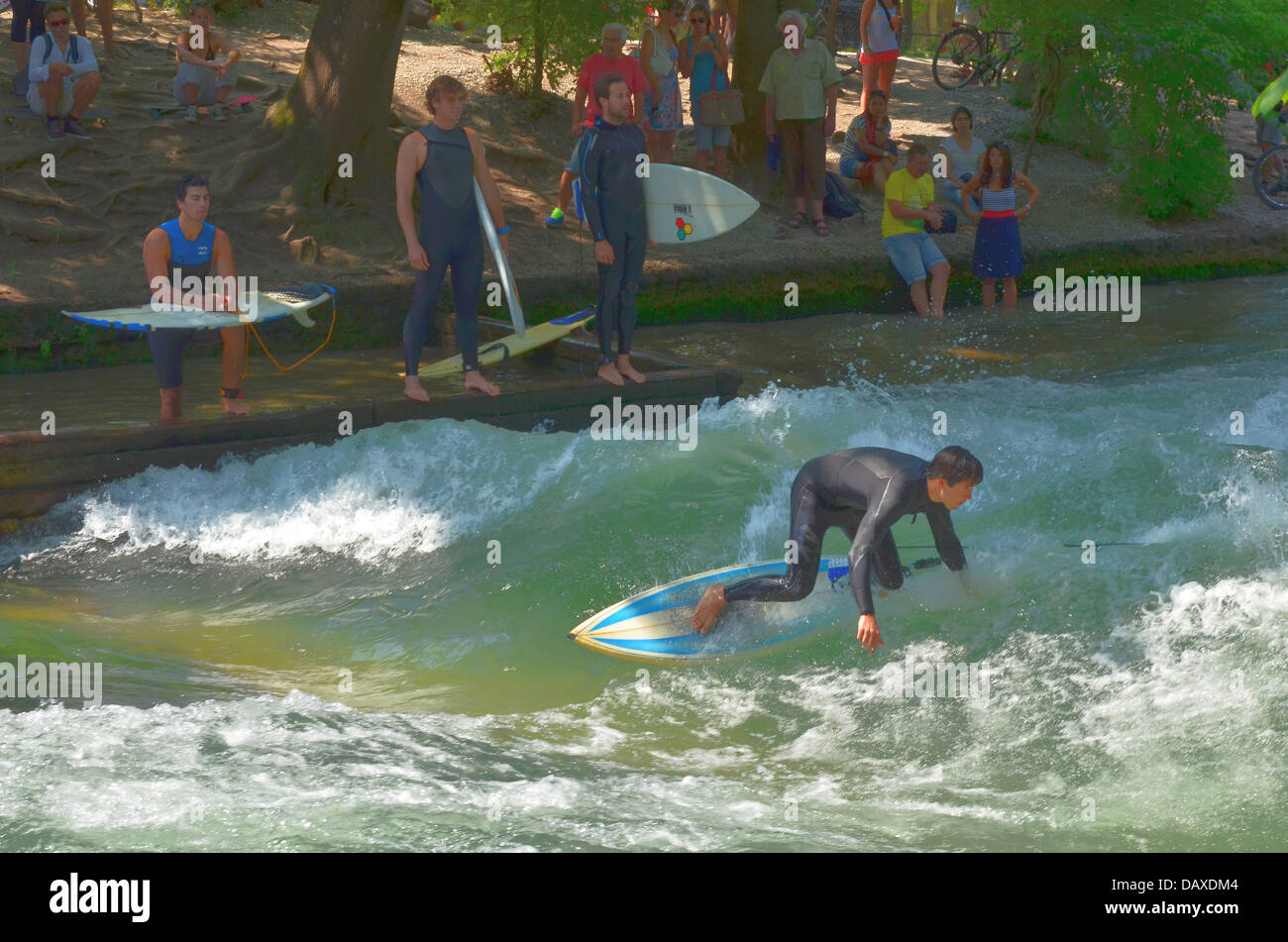 Surfing on the famous wave of the Eisbach in Munich Stock Photo - Alamy