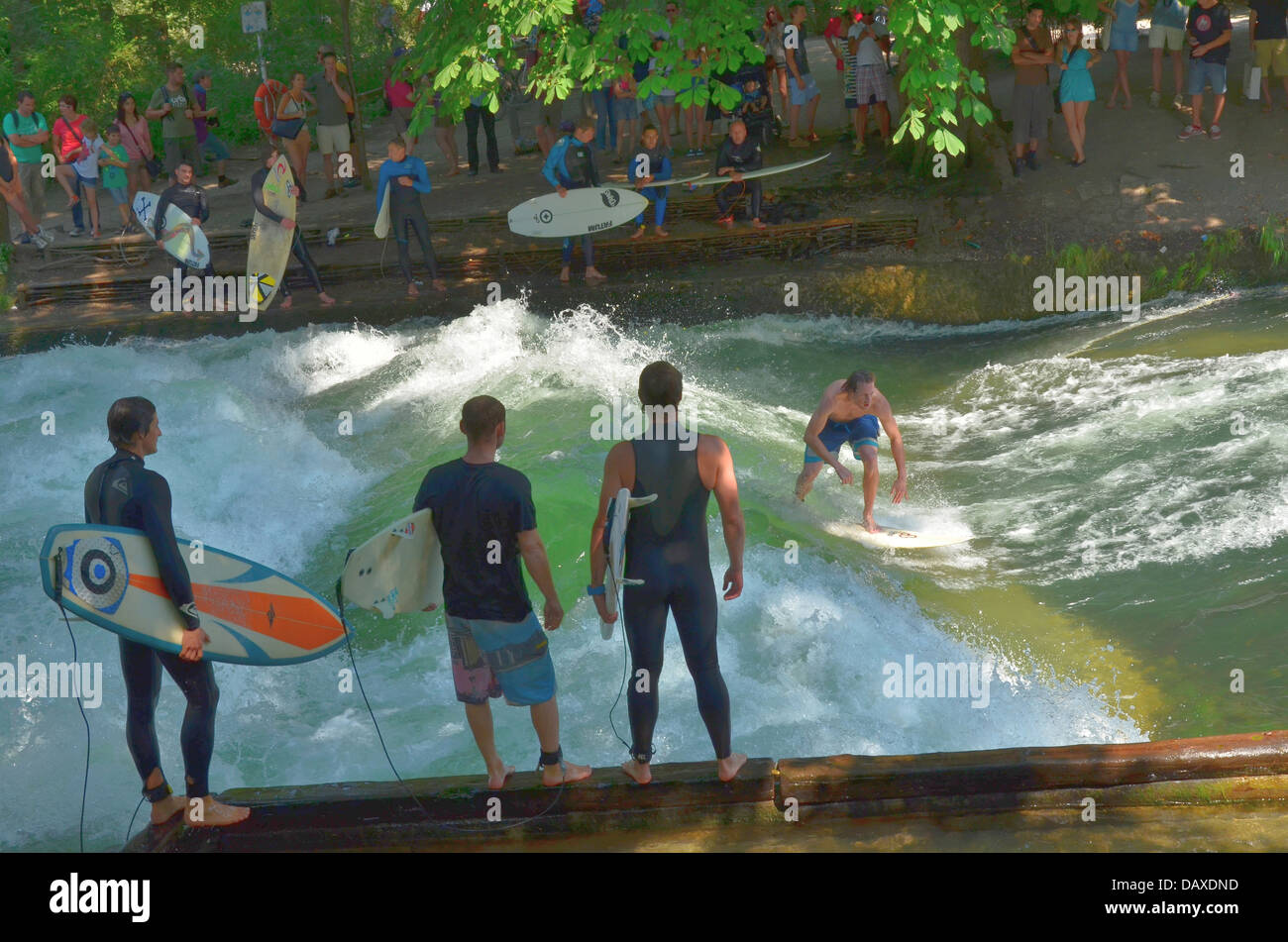 Surfing on the famous wave of the Eisbach in Munich Stock Photo - Alamy