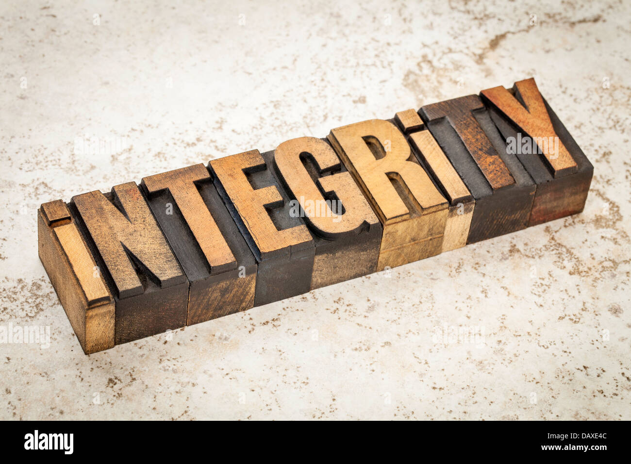 integrity word in vintage letterpress wood type on a ceramic tile ...