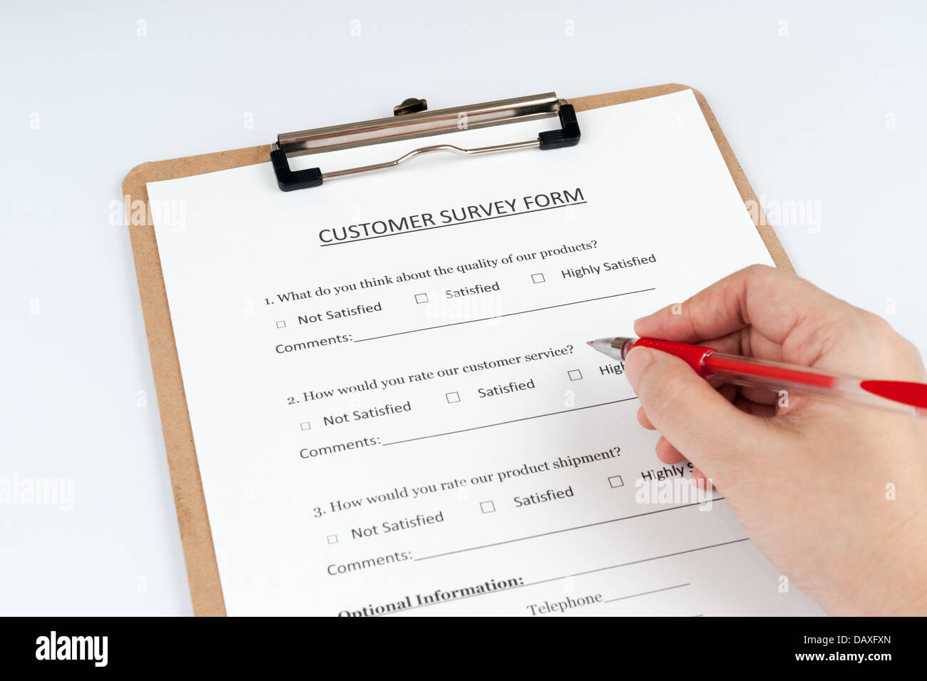 FIlling customer survey form using a red pen Stock Photo - Alamy