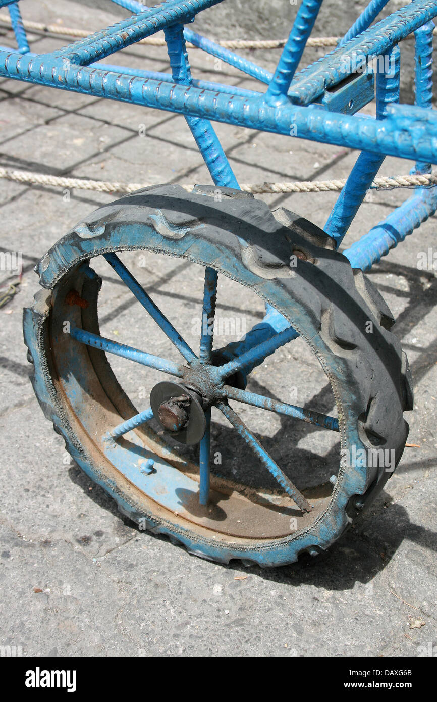 The rubber covered wheel of a cart used to transport merchandise in the ...