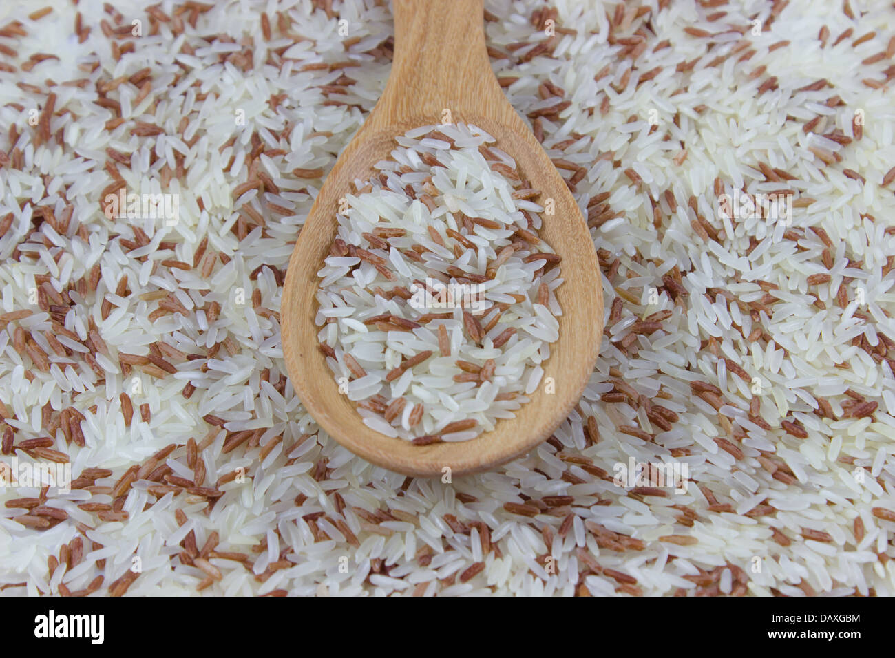 Red and white rice on spoon Stock Photo - Alamy