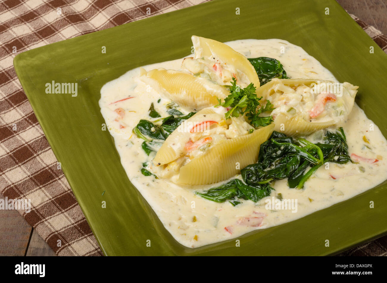 Stuffed pasta shells with crab alfredo filling Stock Photo - Alamy