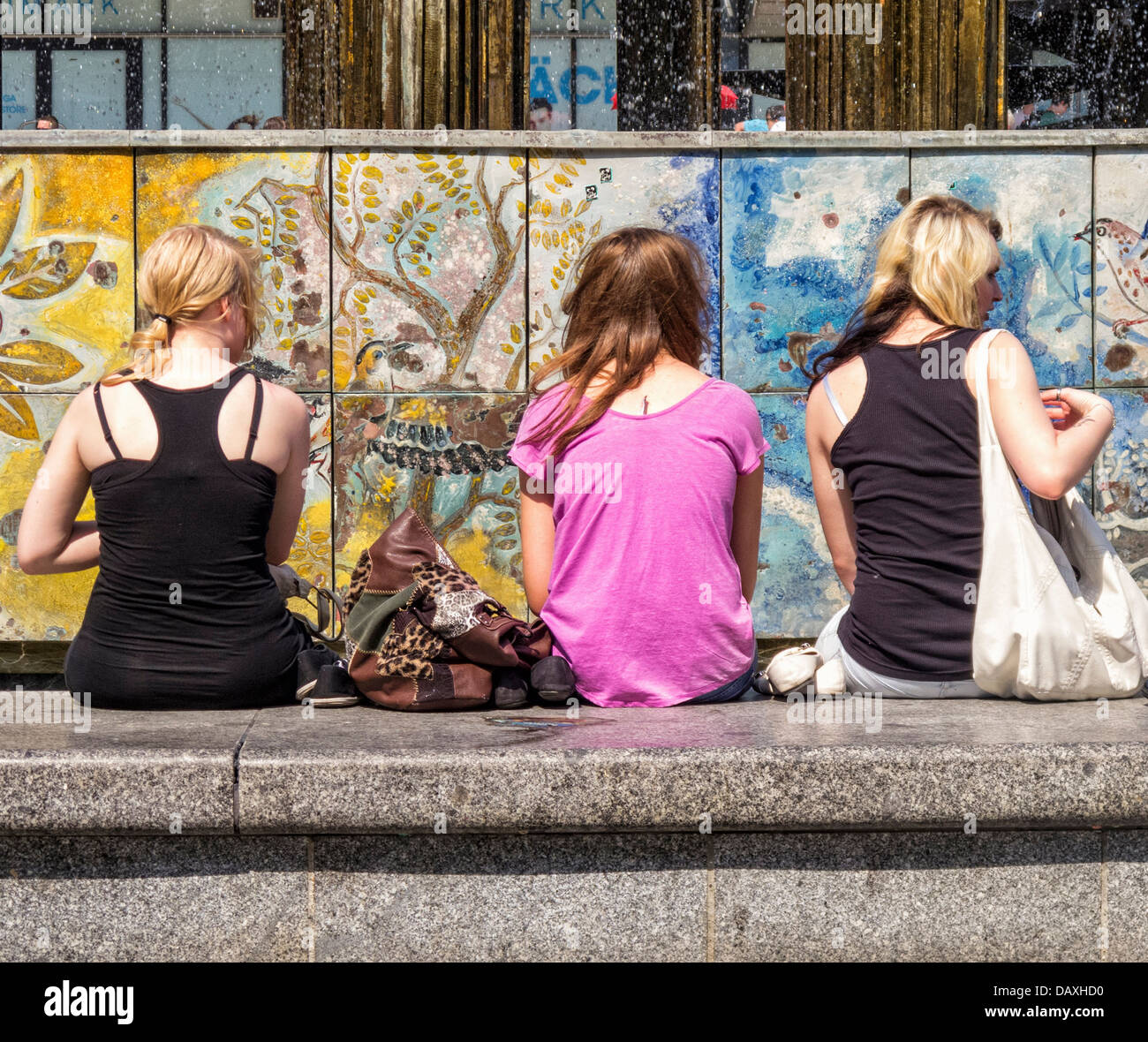 Three girls cooling off at the "Fountain of International Friendship ...